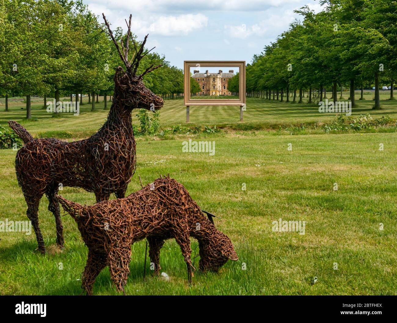 View of Archerfield House through frame with willow deer sculptures ...