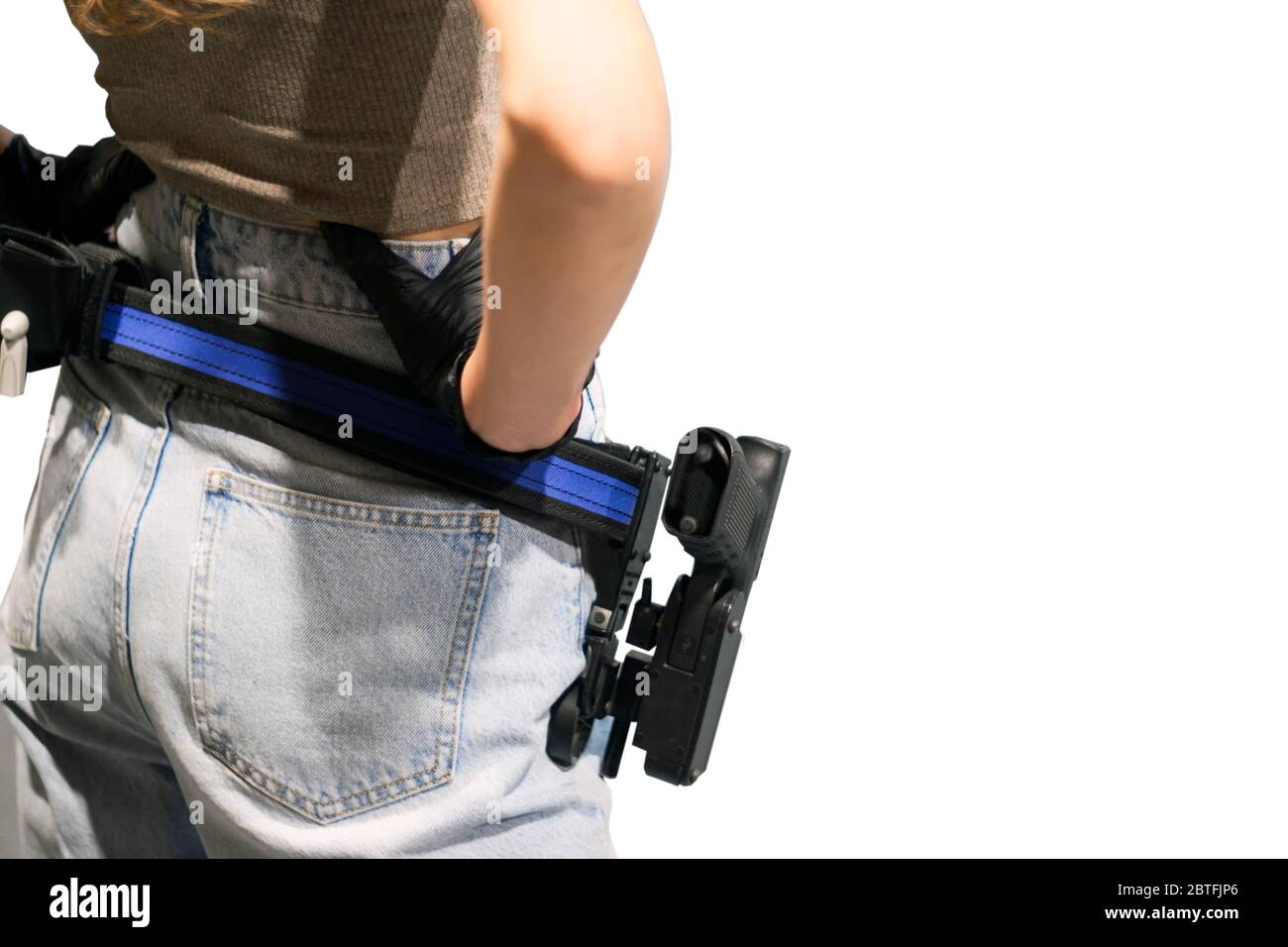 Armed female wearing a cartridge belt with a gun, isolated on white ...