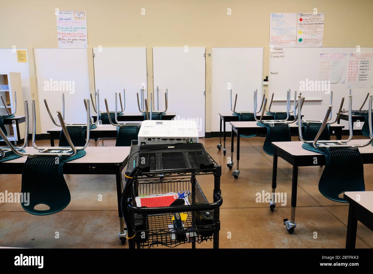 Empty classroom in an American high school; closed for distance ...
