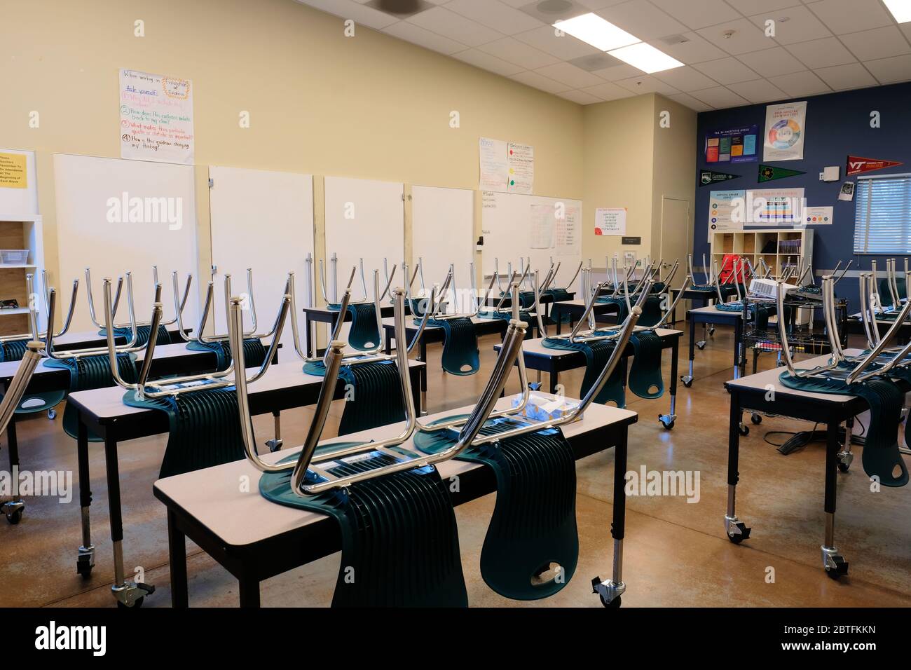 Empty classroom in an American high school; closed for distance ...