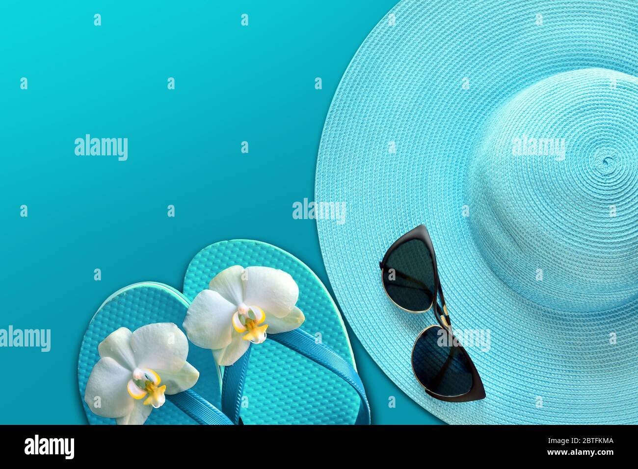Summer hat with sunglasses. Top view, minimal concept over a blue ...
