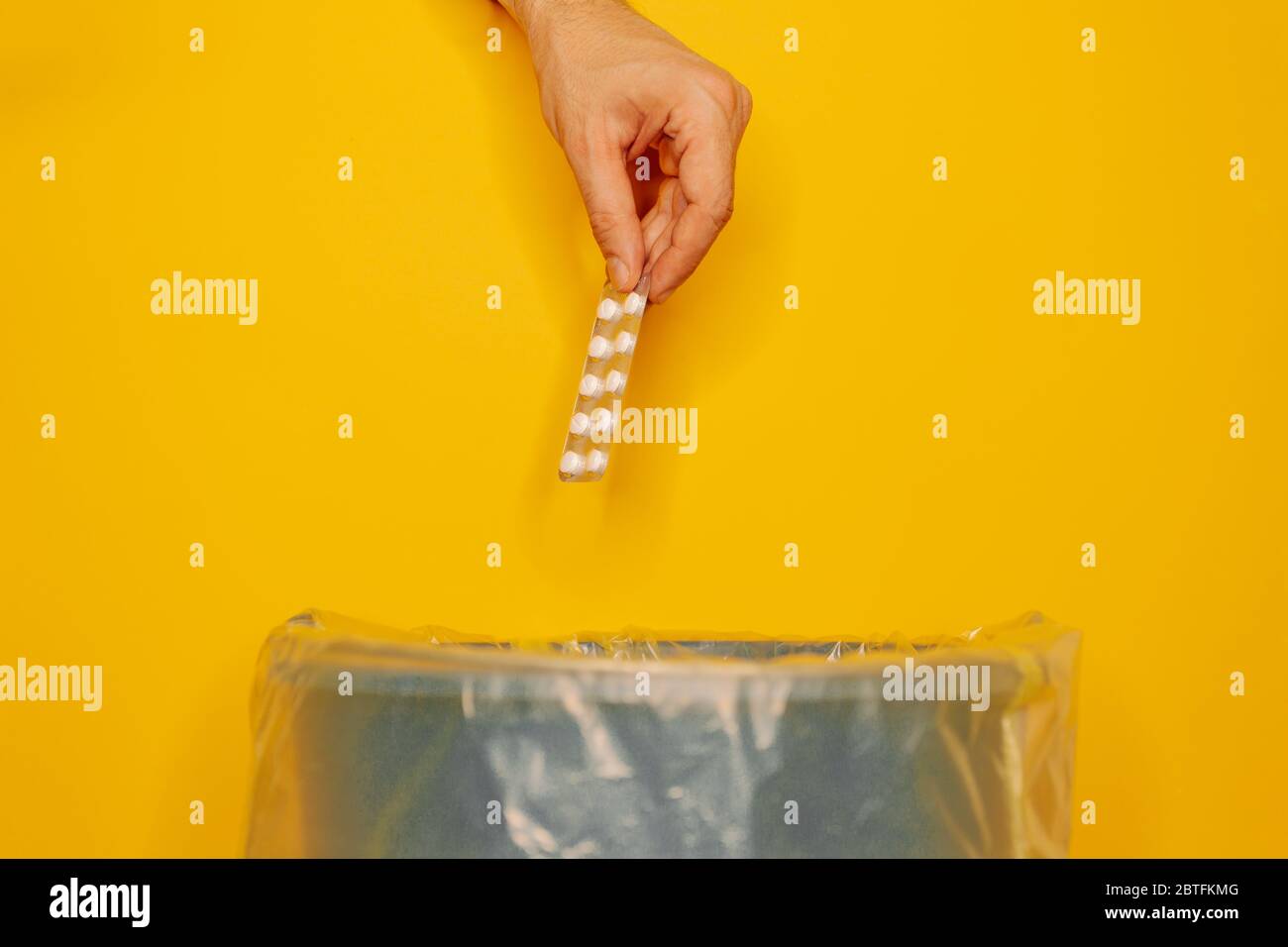 hand throwing pills away on orange background. Health concept Stock ...