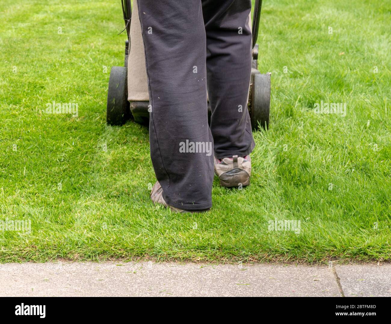 Woman pushing lawn mower hi-res stock photography and images - Alamy