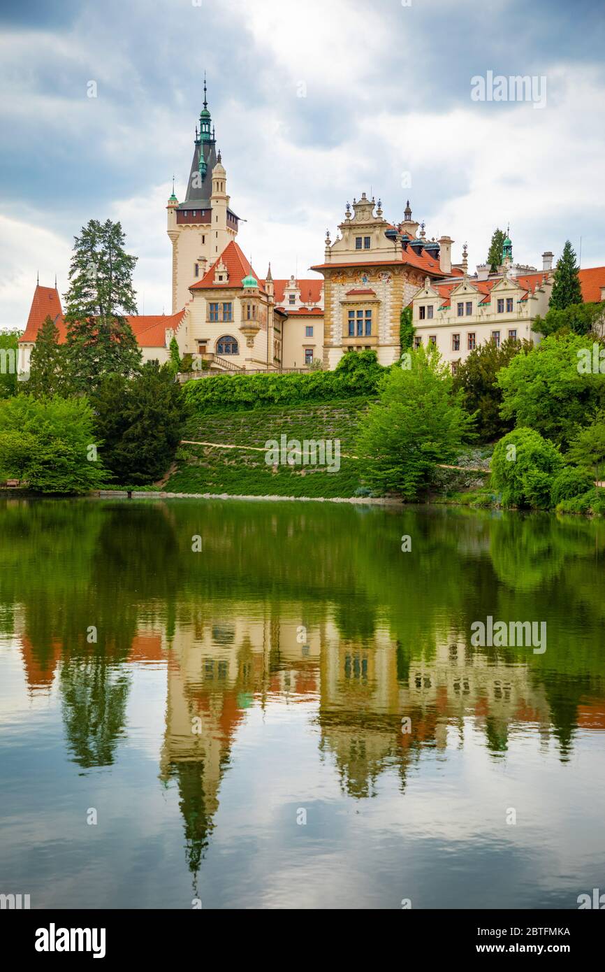 Castle with reflection in pond in spring time in Pruhonice, Czech ...