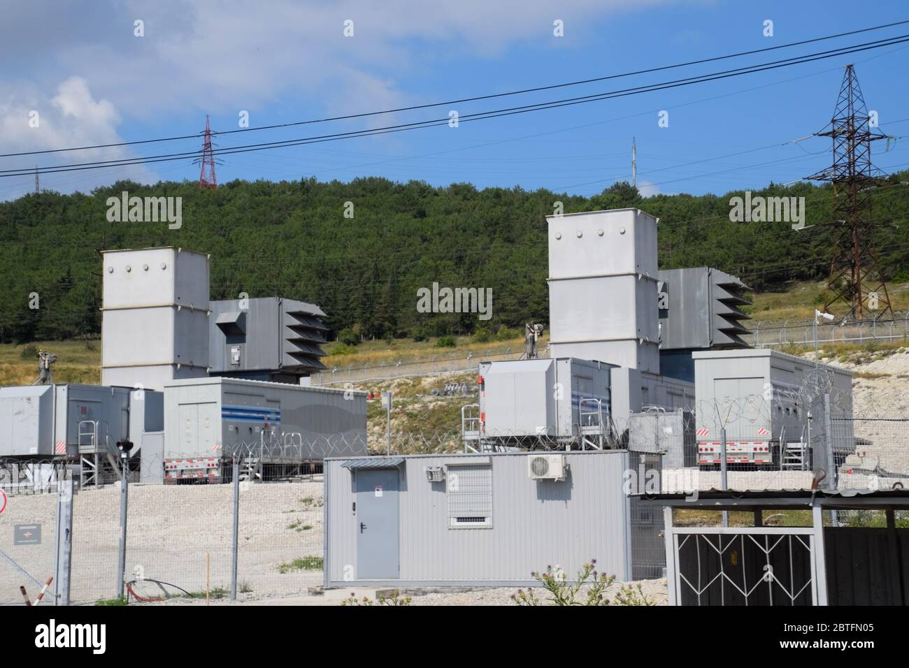 a Power substation equipment, transformers and wire poles Stock Photo ...