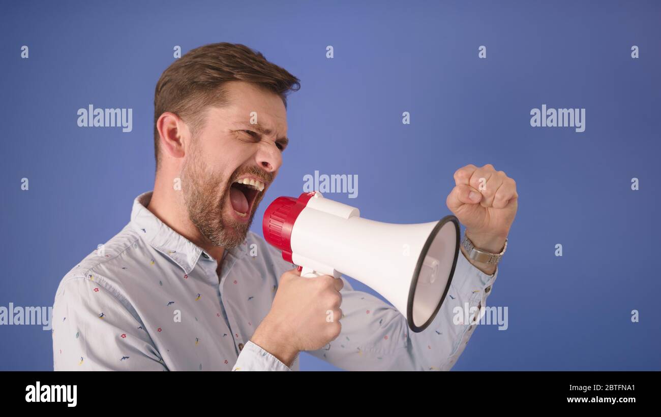 Angry man shouting loudspeaker hi-res stock photography and images - Alamy