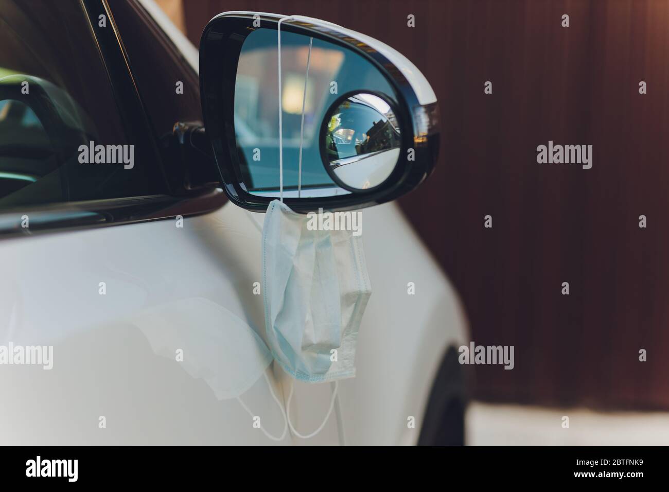 The medical mask in the car, virus concept Stock Photo - Alamy