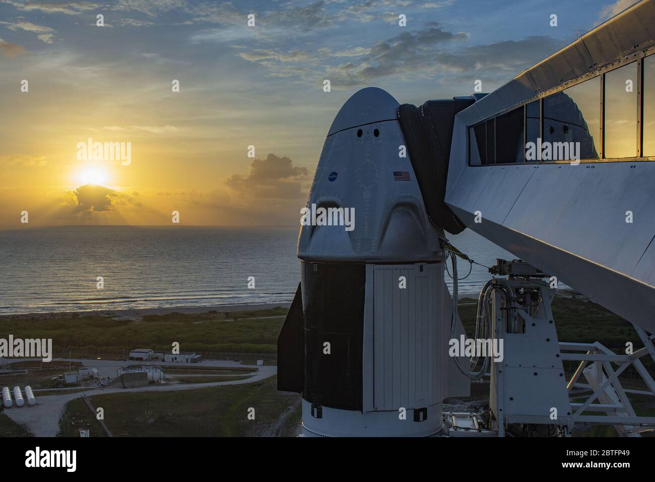 View of the crew access arm in position with the Crew Dragon spacecraft ...