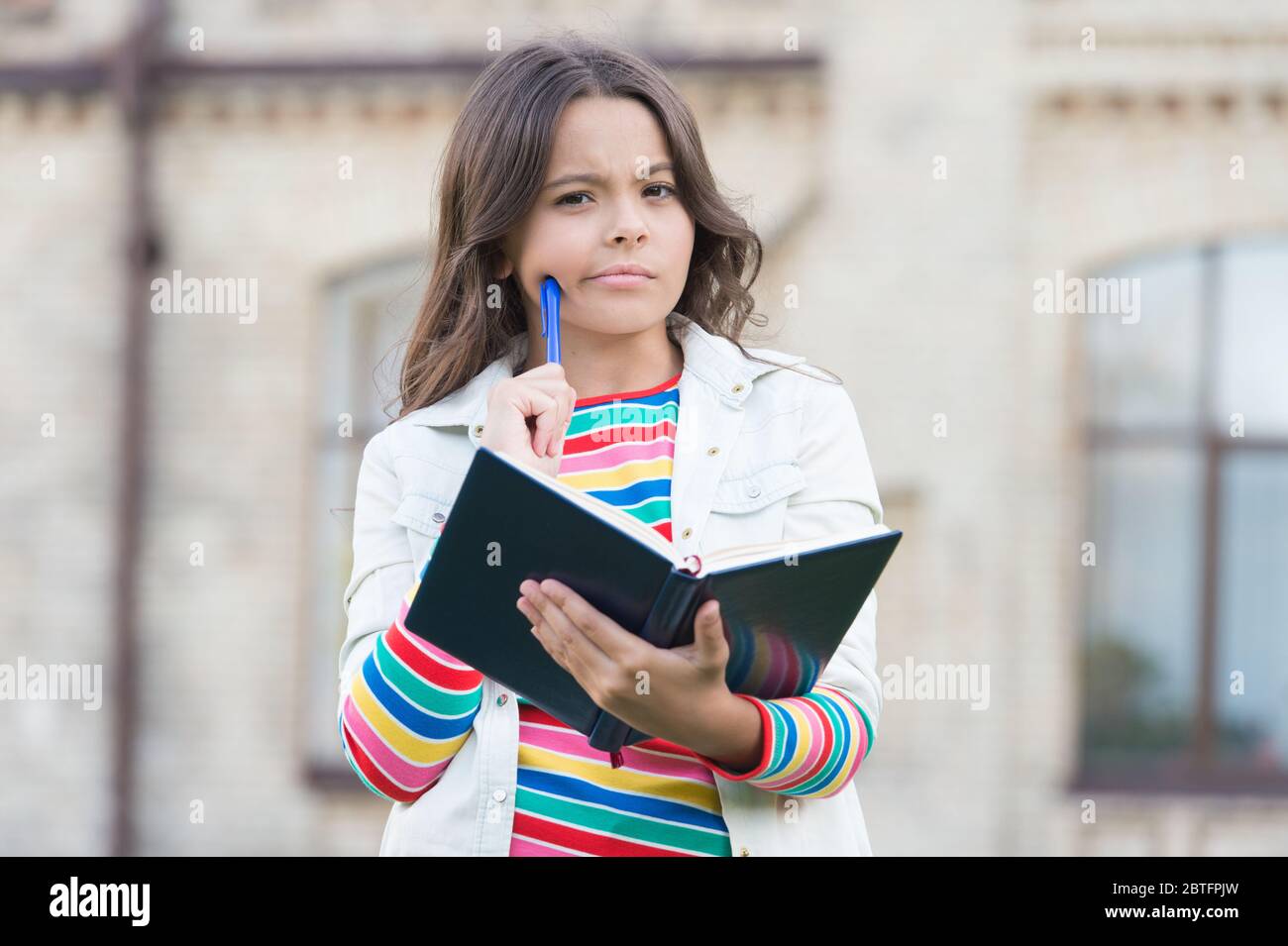 Making notes. Inspired poet. Talented cute schoolgirl. Access to much ...