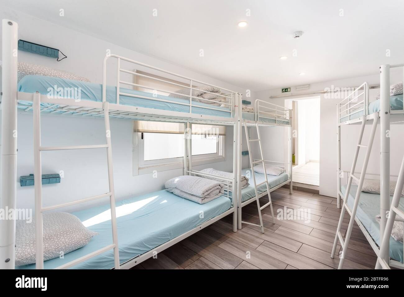 Clean bedroom with bunk beds in a hotel, a hostel for tourists Stock ...