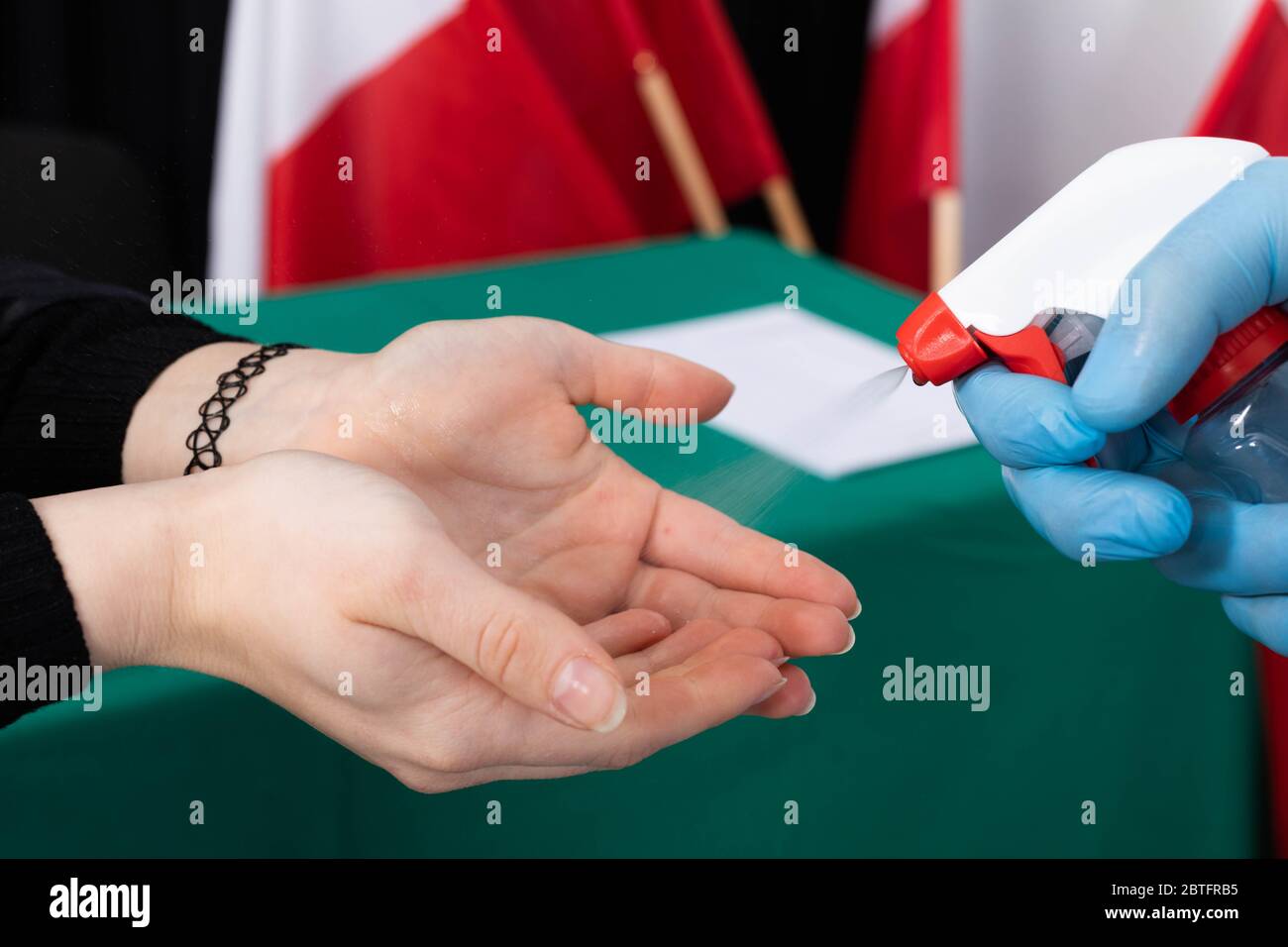Female hands. Hand disinfection. Polling station. Presidential election ...