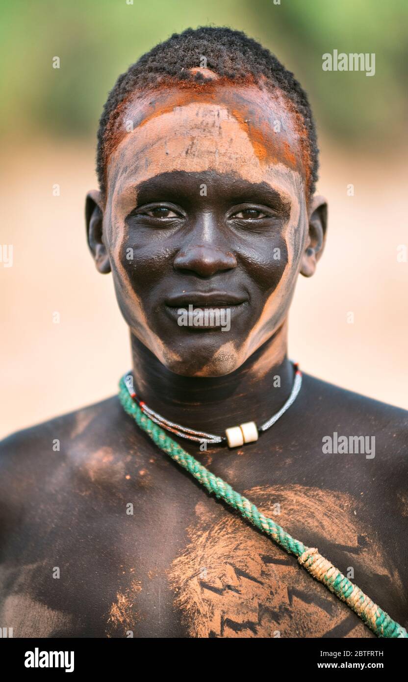 MUNDARI TRIBE, SOUTH SUDAN - MARCH 11, 2020: Young man with ash painted ...