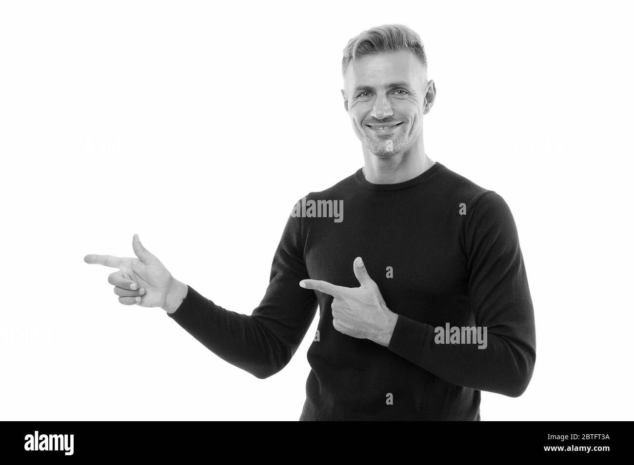 Your logo. Happy man pointing fingers isolated on white. Handsome guy ...