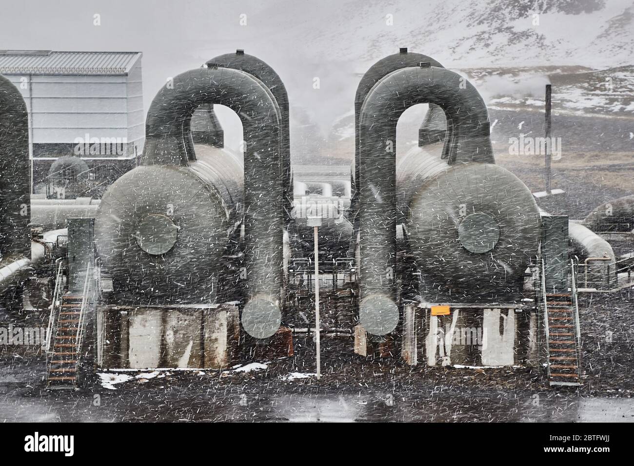Geothermal power plant in falling snow storm Stock Photo - Alamy
