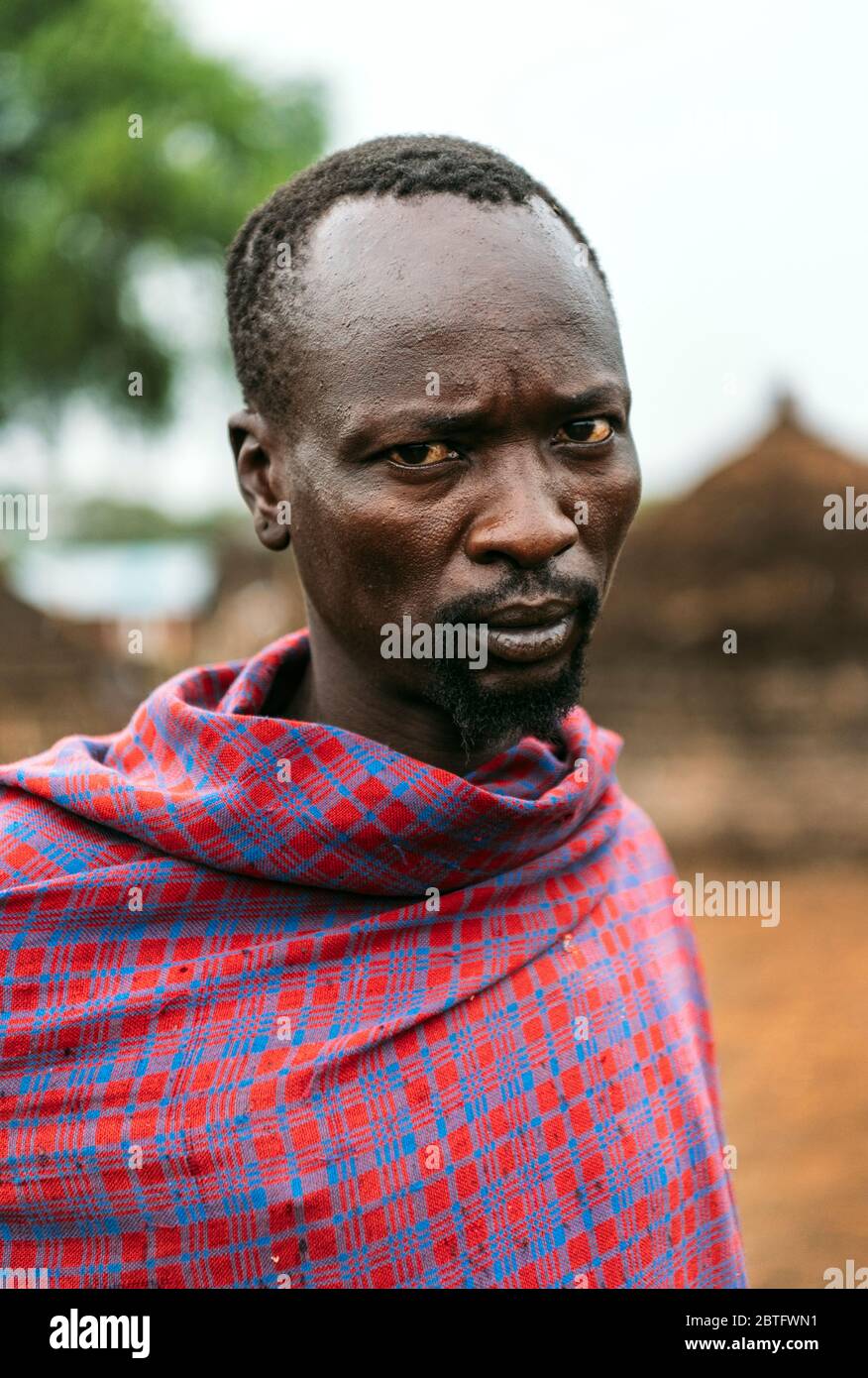 TOPOSA TRIBE, SOUTH SUDAN - MARCH 12, 2020: Adult man in checkered ...
