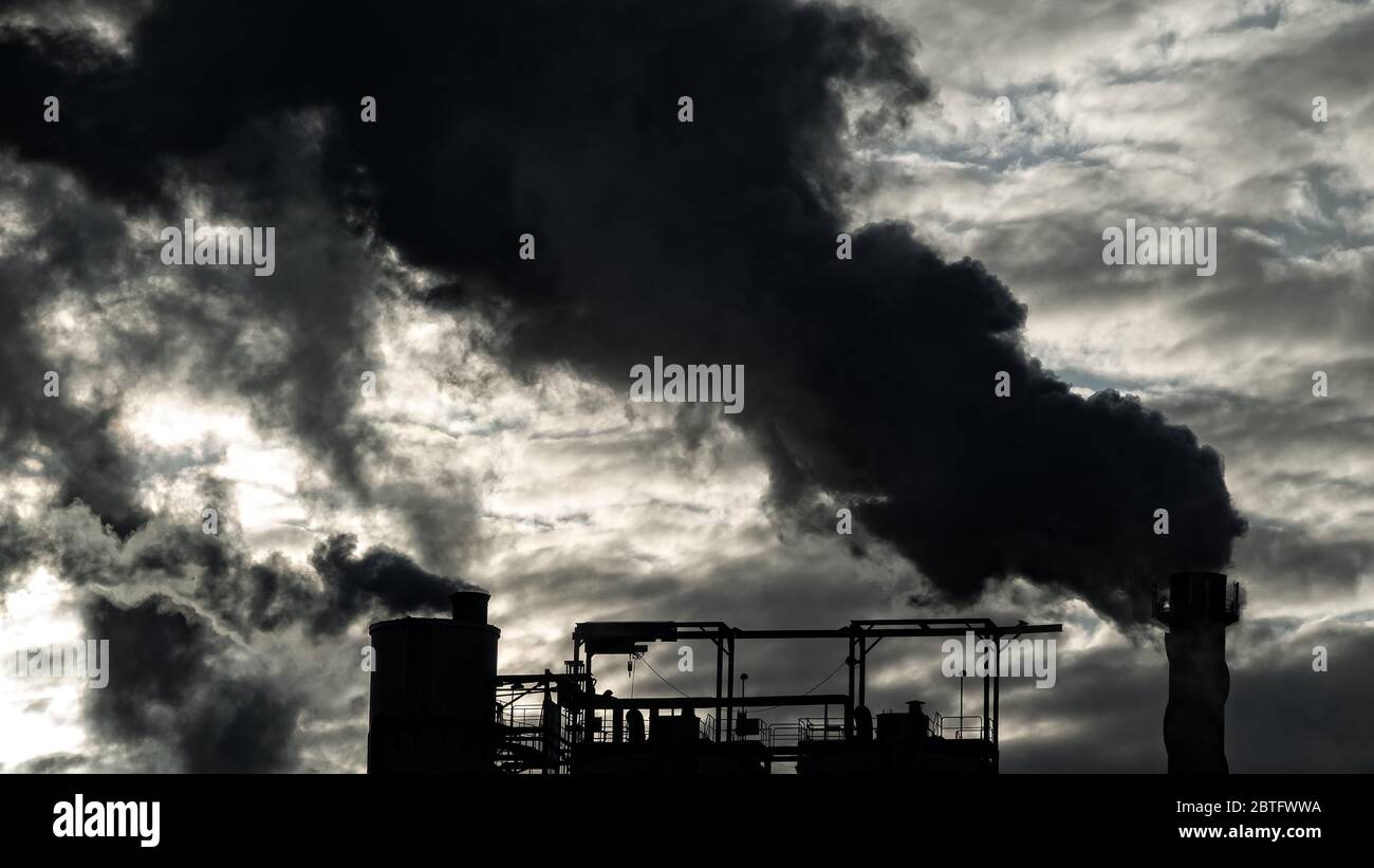 Thick clouds of dirty smoke from plant pollute atmosphere. Problems of ...