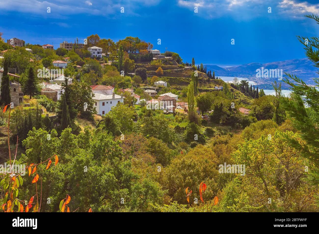 Volos city, sea gulf aerial view, Pelion mountain village and sun rays ...