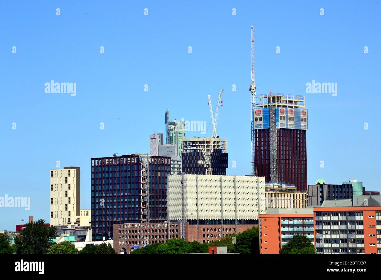 Construction of high rise buildings with tower cranes in central ...
