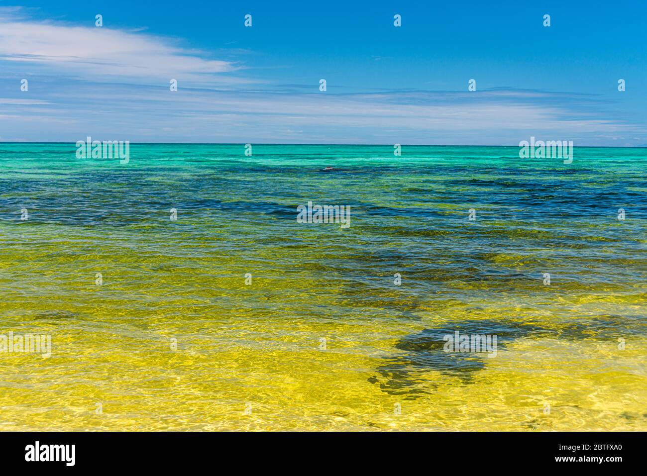 Clear ocean water with colourful shades until the horizon Stock Photo ...