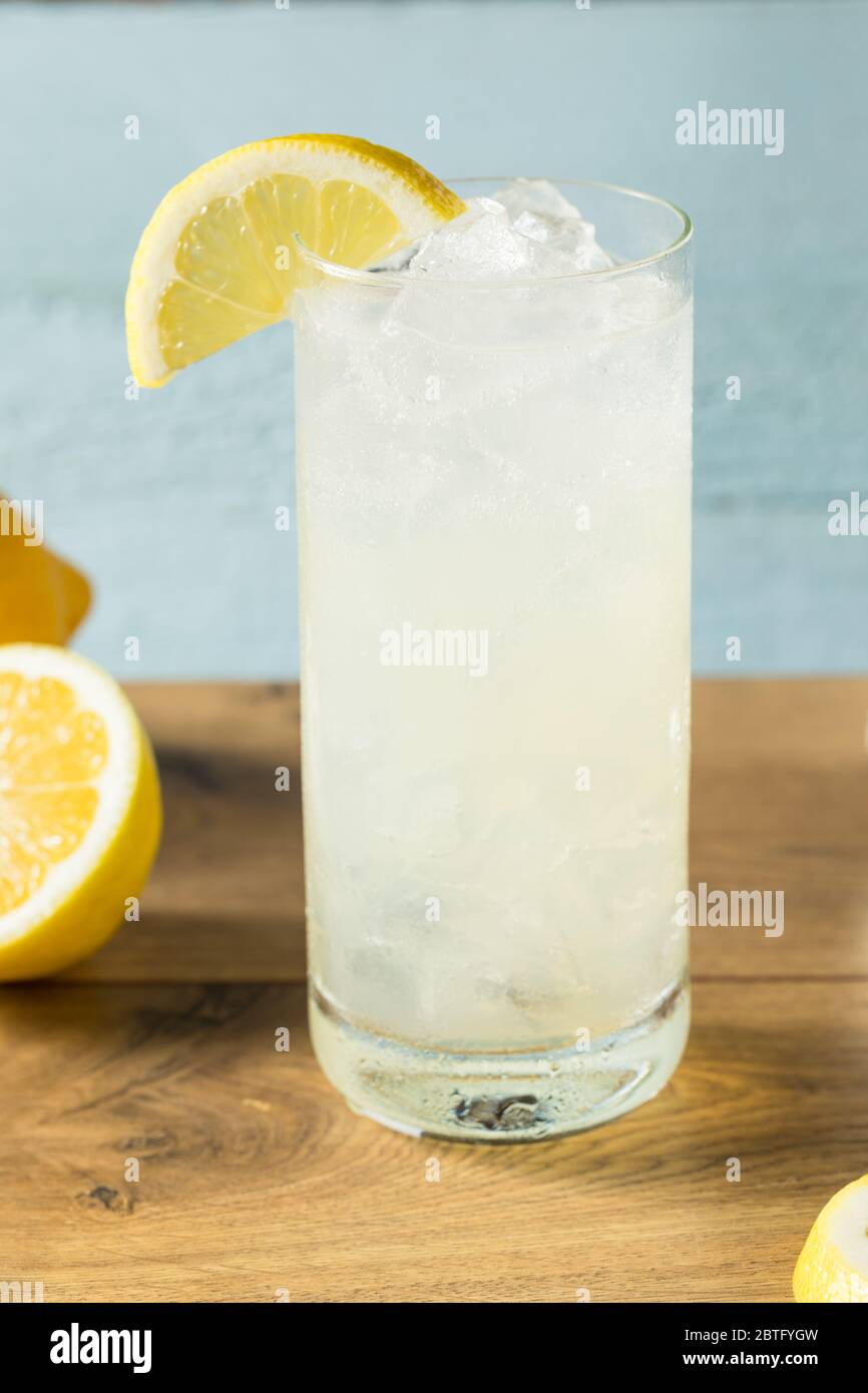 Refreshing Gin Tom Collins Cocktail with Lemon Stock Photo - Alamy