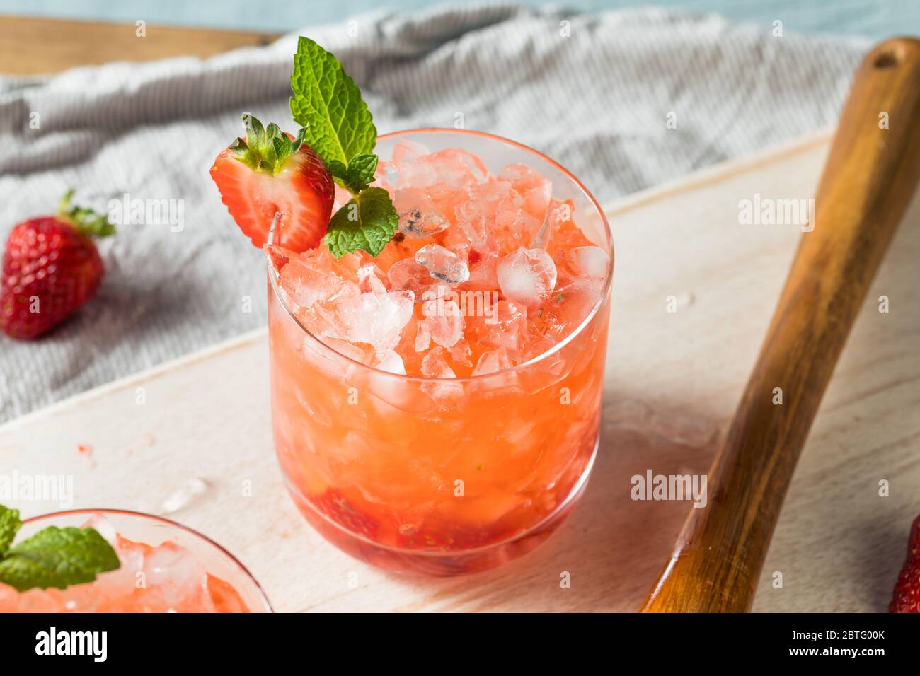 Homemade Boozy Strawberry Mint Smash Cocktail with Gin Stock Photo - Alamy