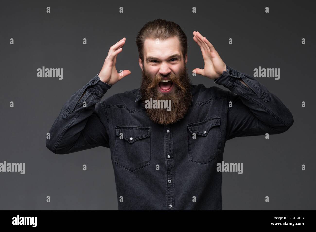 Furious young man beard yelling hi-res stock photography and images - Alamy