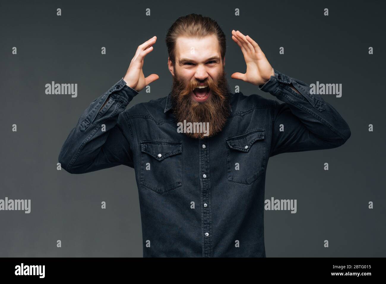 Furious young man beard yelling hi-res stock photography and images - Alamy