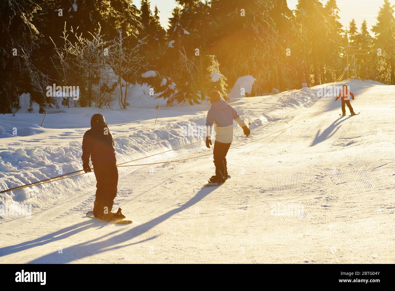 Wintersport fun snowboarding and skiing Stock Photo - Alamy