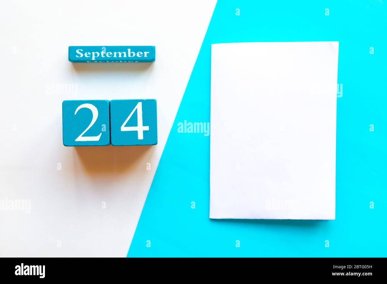 September 24. Wooden handmade calendar and white mockup blank on ...