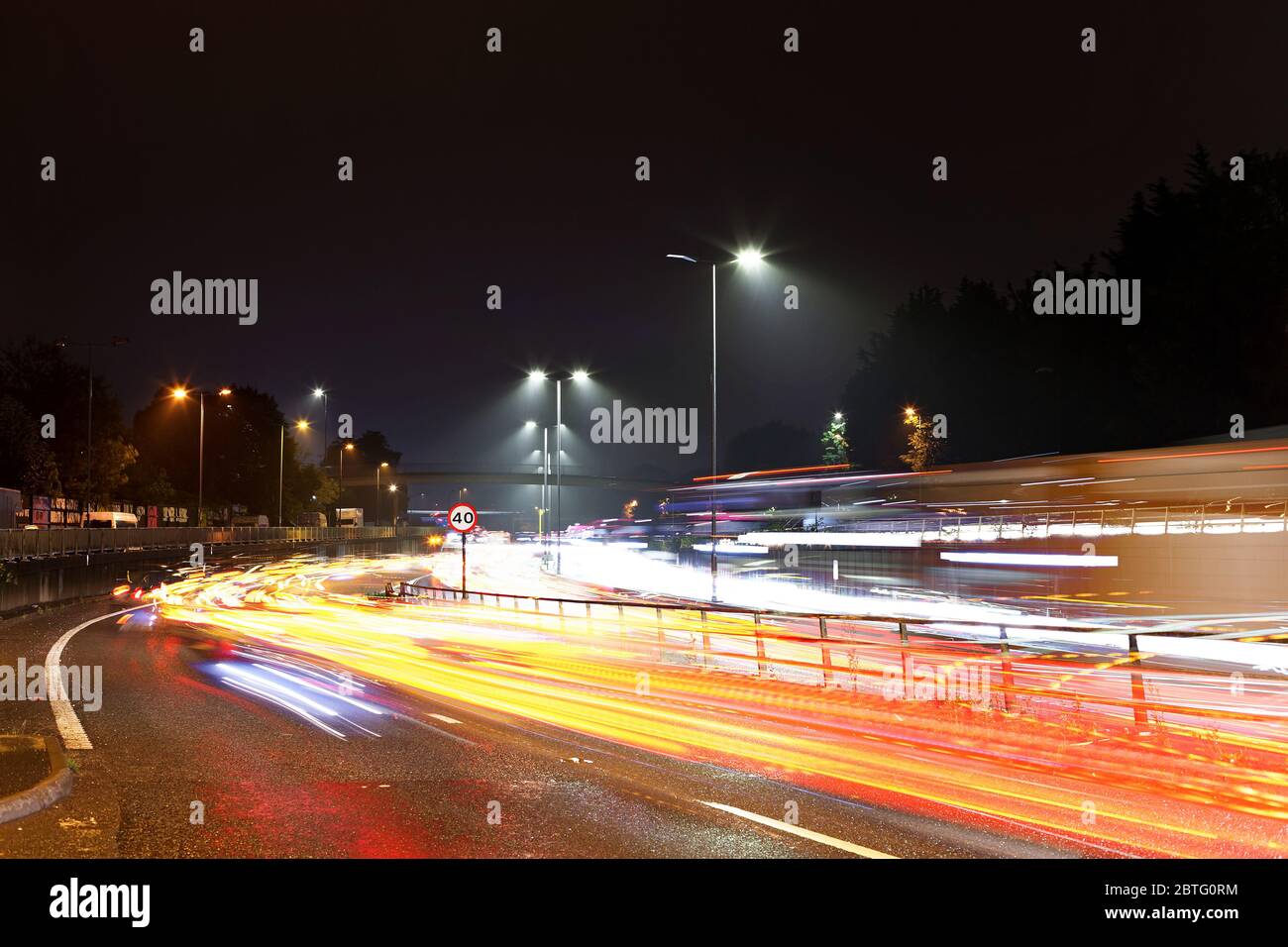 Orange light trails on the motorway Stock Photo - Alamy