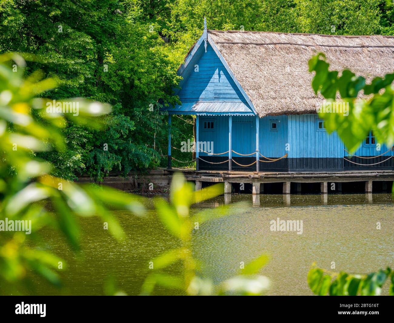 Beautiful landscape with a blue house build on water surrounded Stock ...