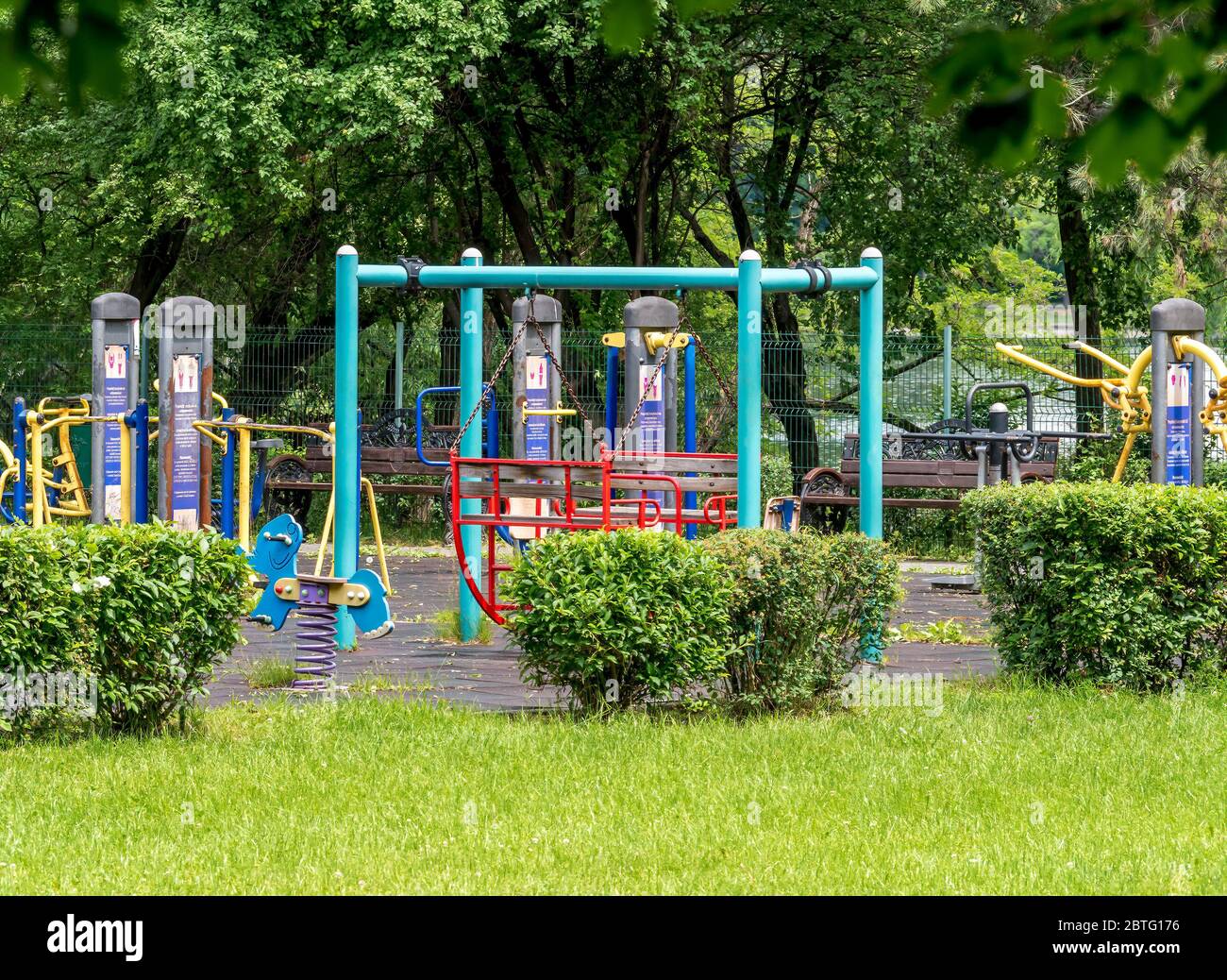 An empty children's playground in Bucharest, Romania. Children swings ...
