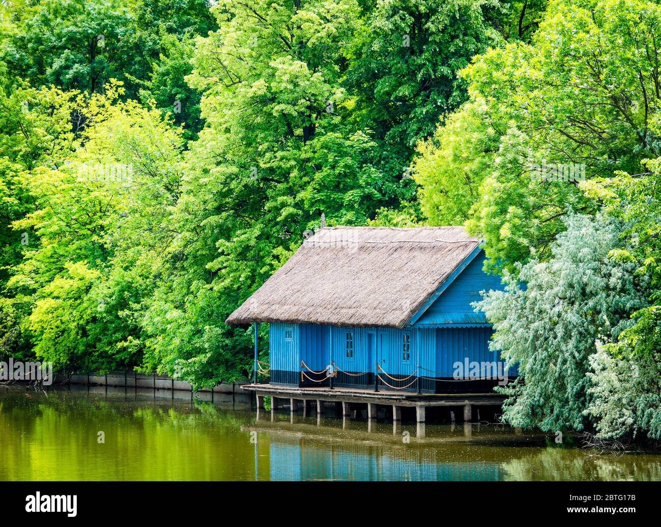 Beautiful landscape with a blue house build on water surrounded Stock ...