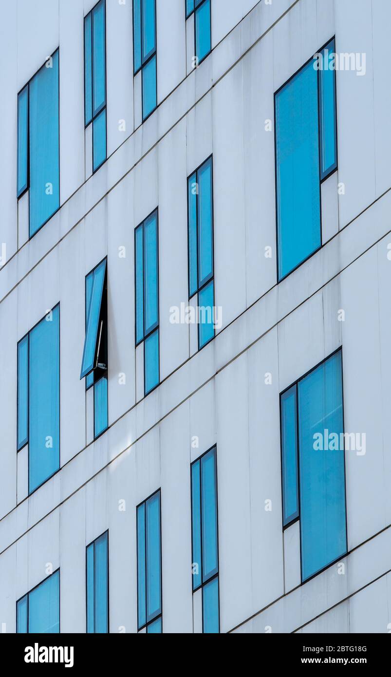 Detail with a modern common architecture. Glass building with one ...