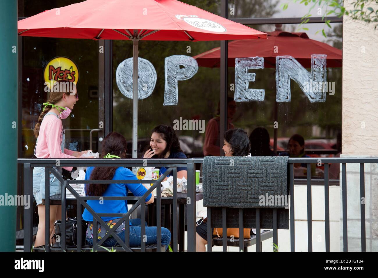 Wesley Chapel, FL, USA. 24th May, 2020. A group of women enjoy lunch at ...