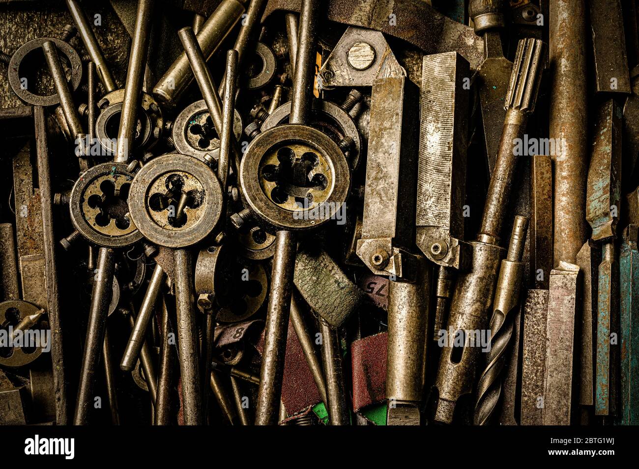 rusted steel tools and threaders on the table in metal factory workshop ...