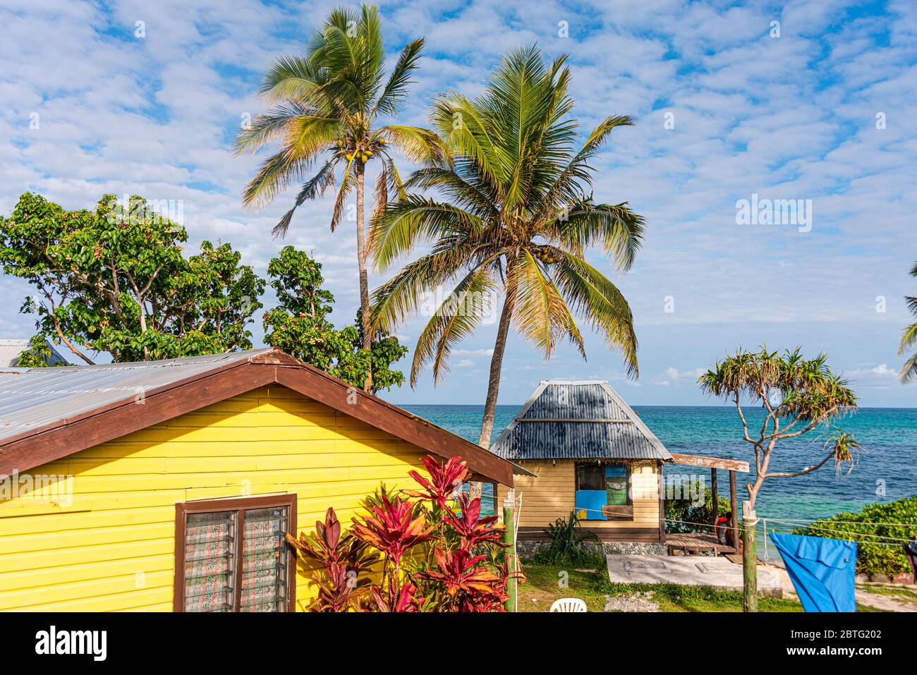 Yellow bungalows of the sunrise lagoon homestay on Nanuya lailai. Fiji ...
