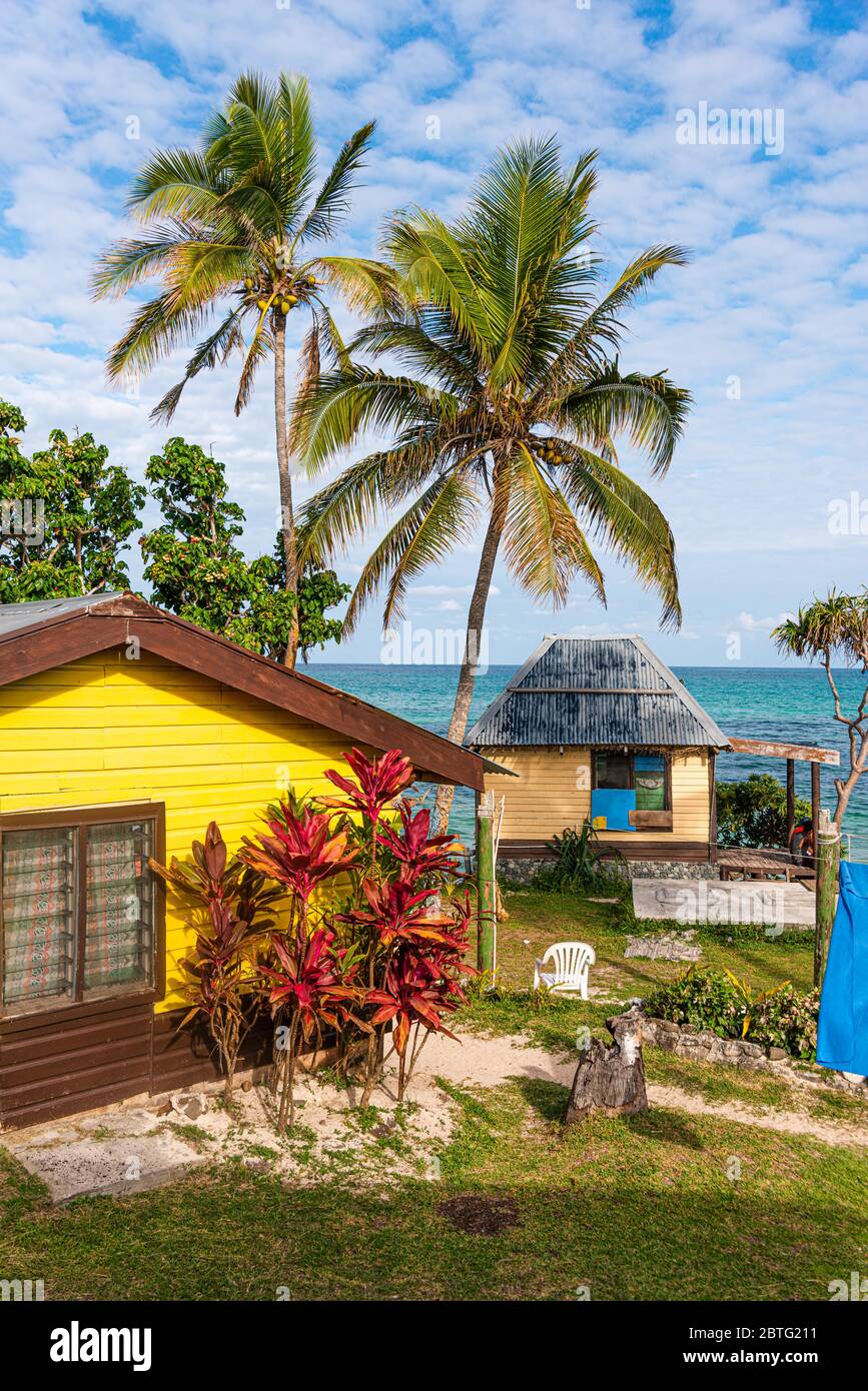 Yellow bungalows of the sunrise lagoon homestay on Nanuya lailai. Fiji ...