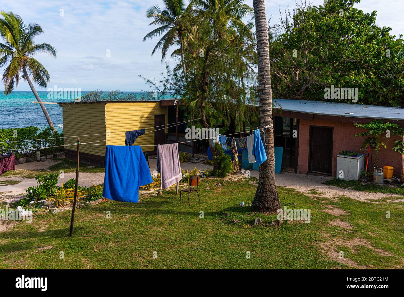 Yellow bungalows of the sunrise lagoon homestay on Nanuya lailai. Fiji ...