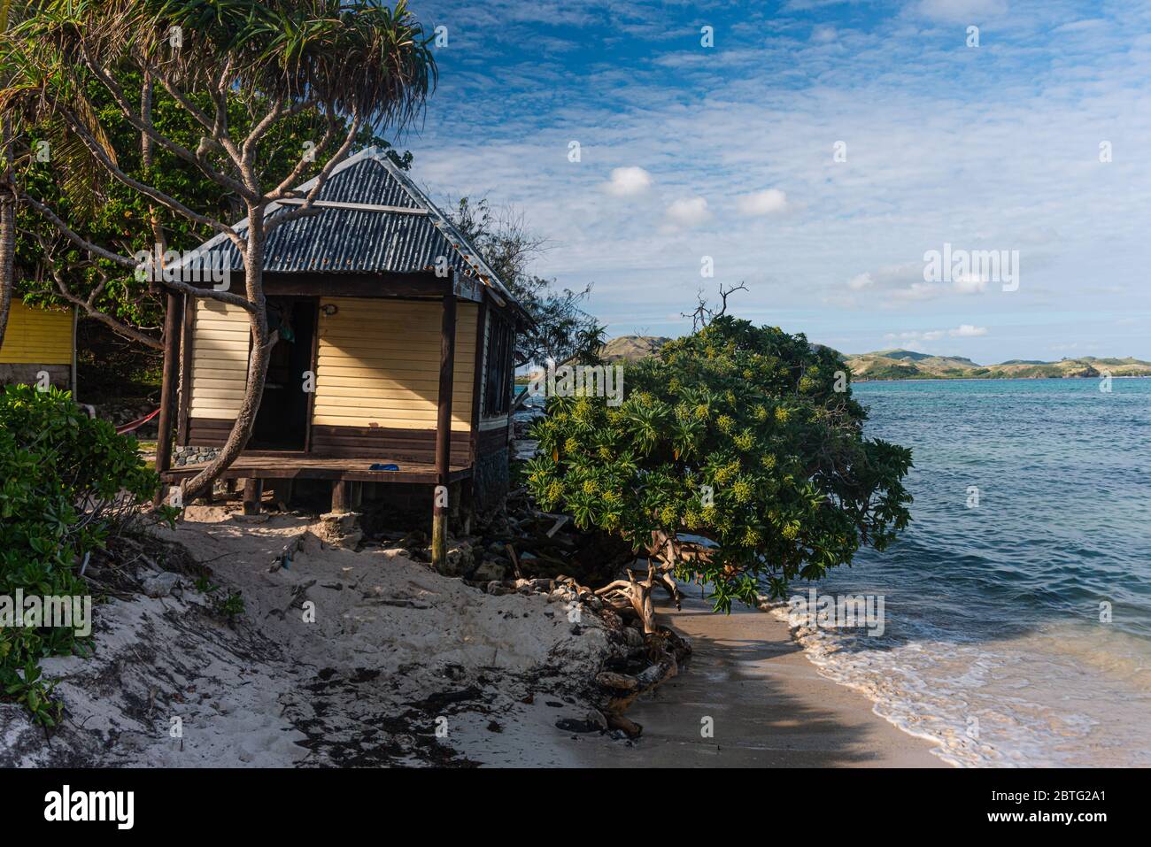 Yellow bungalows of the sunrise lagoon homestay on Nanuya lailai. Fiji ...