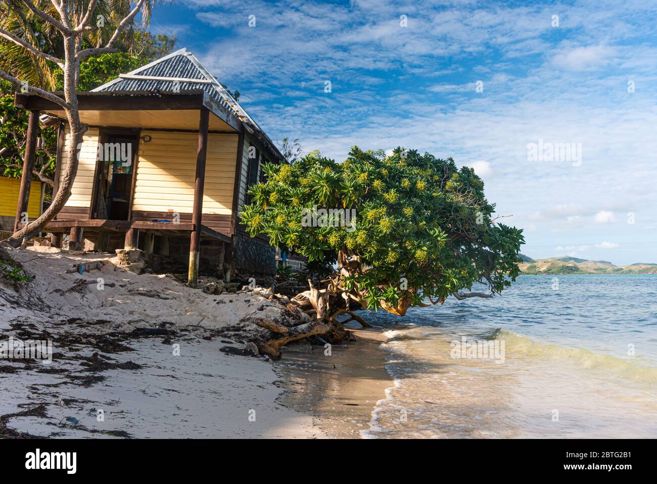 Yellow bungalows of the sunrise lagoon homestay on Nanuya lailai. Fiji ...