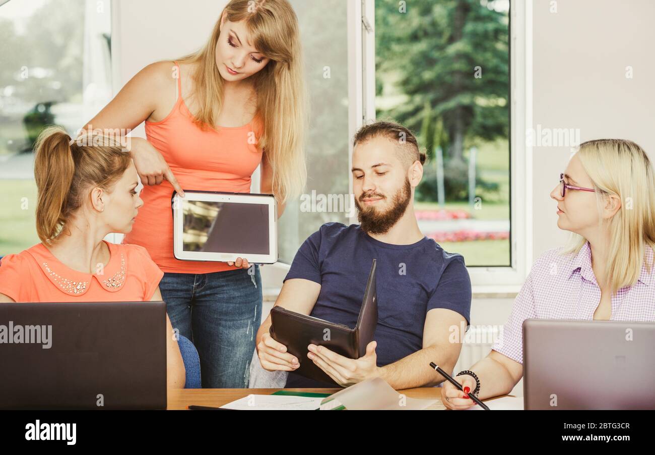 Teaching helping technology concept. Woman young teacher or tutor with ...