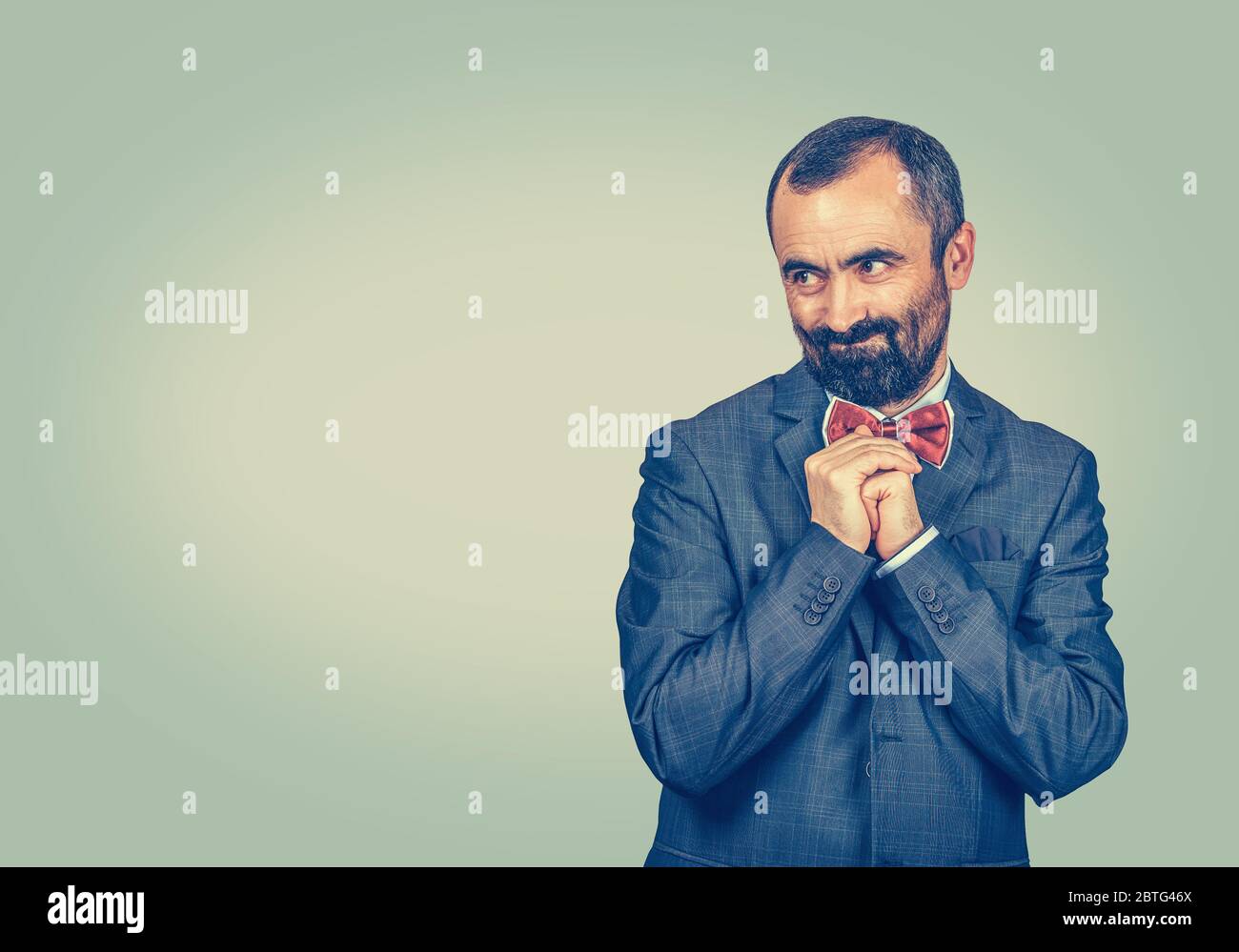 Portrait young man in unpleasant awkward situation playing nervously ...