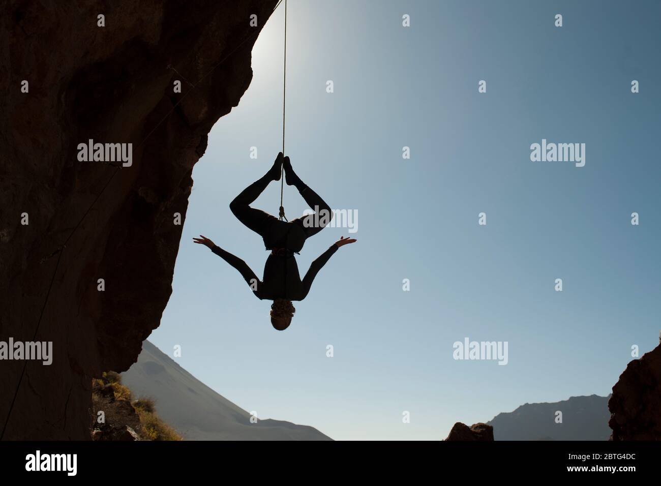 silhouette of a dancing woman at cliff Stock Photo - Alamy