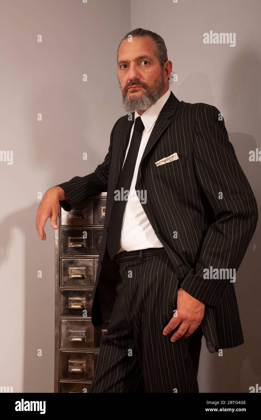 mafia boss in dark clothes Stock Photo - Alamy
