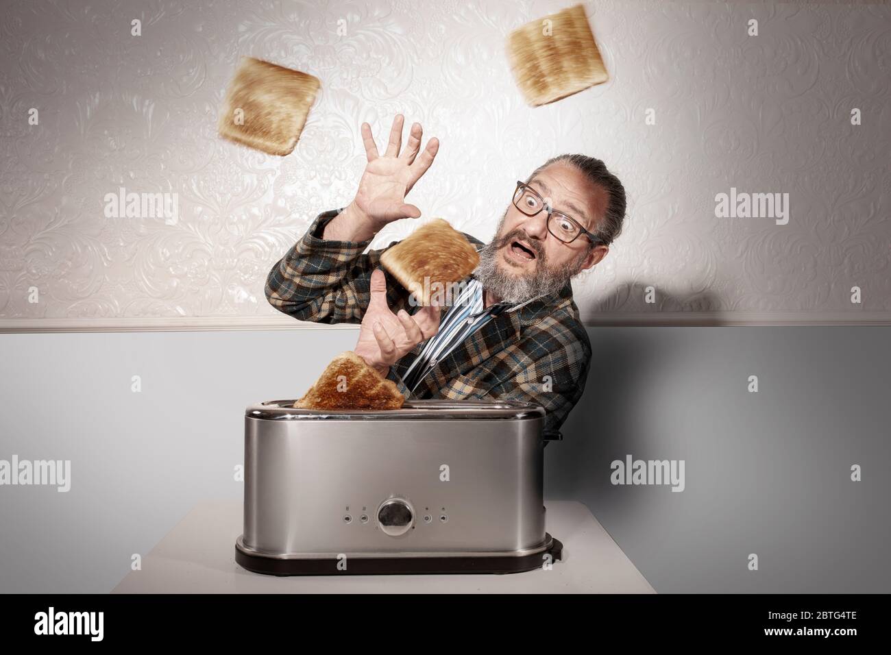 nerdy man preparing toast Stock Photo - Alamy