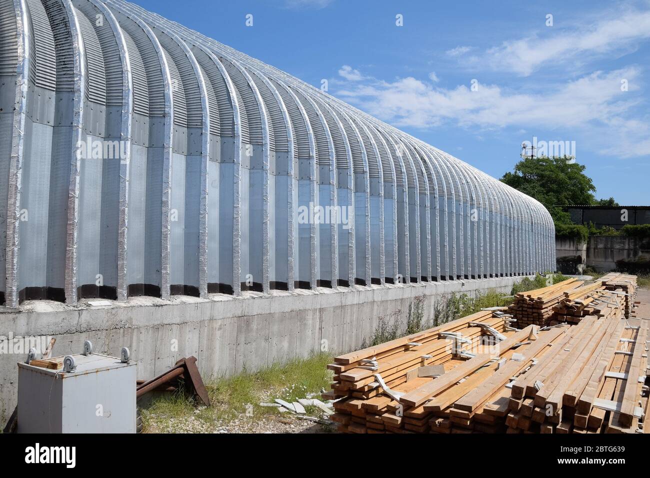 Warehouse of building materials. a Building base, metal, wood and ...