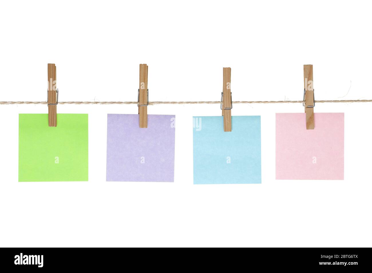 Colored reminder notes on string line with pegs Stock Photo - Alamy