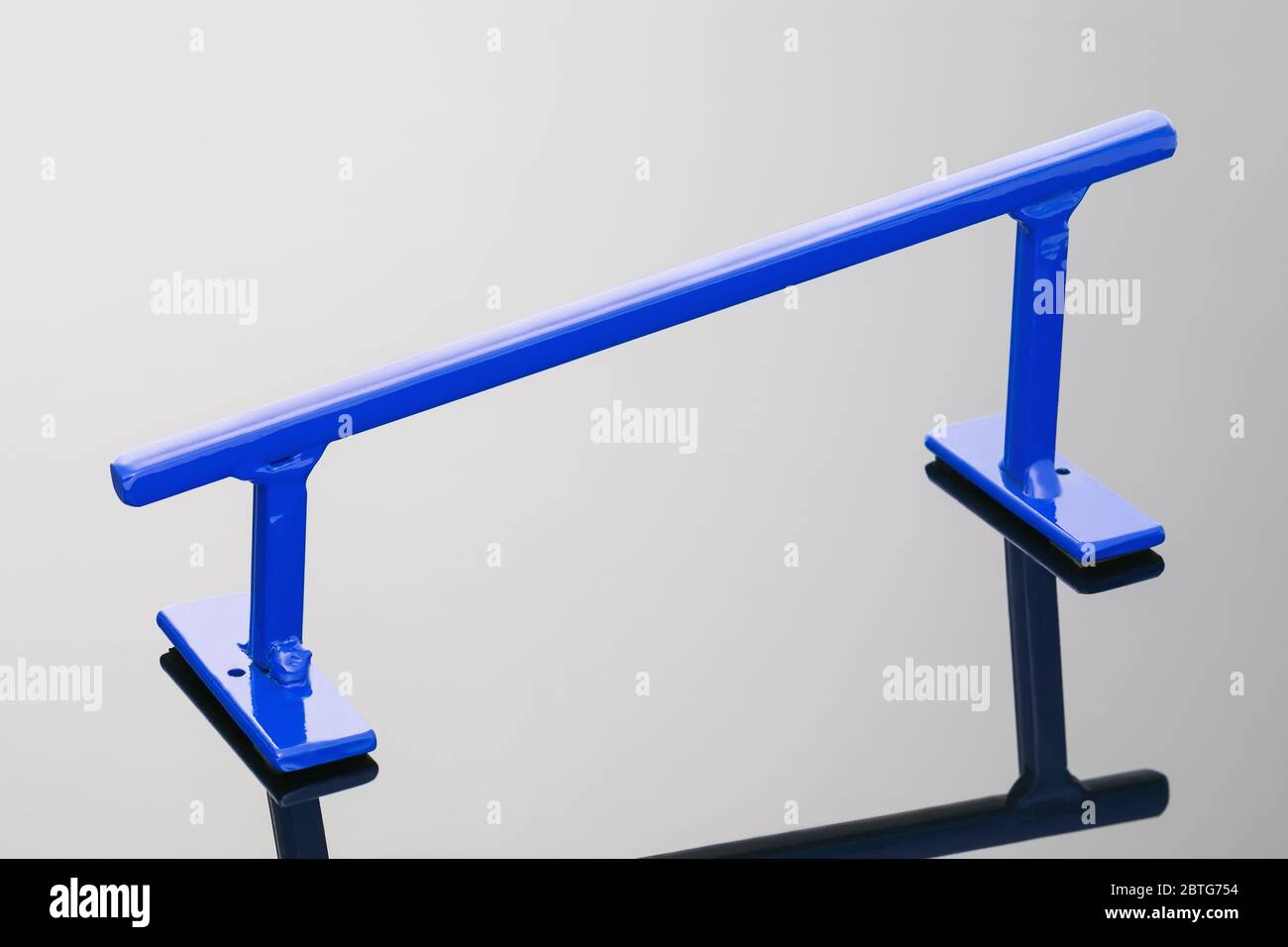 Blue metal railings for fingerboards, close-up Stock Photo - Alamy