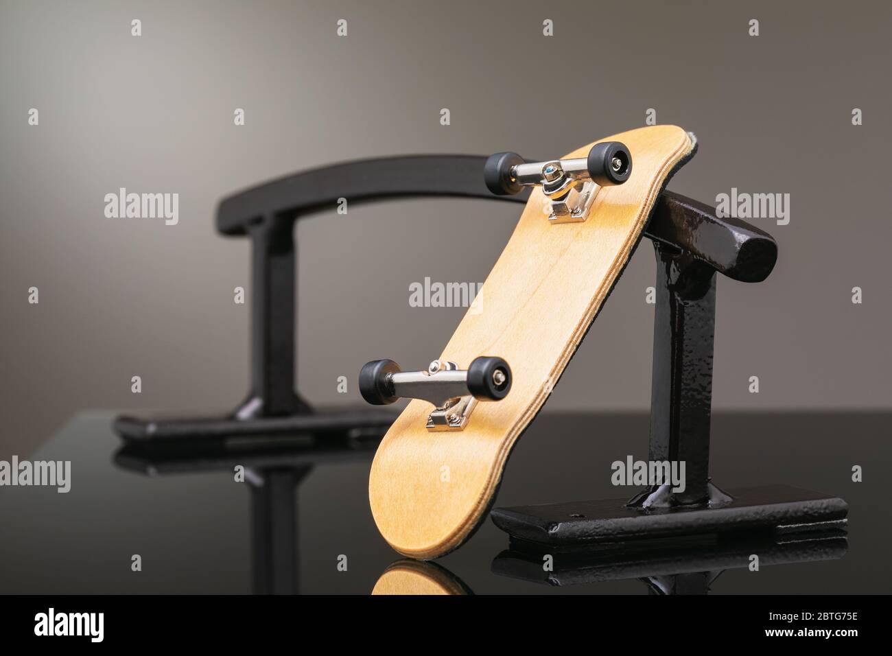 Fingerboard on a metal railing of black color, close-up Stock Photo - Alamy